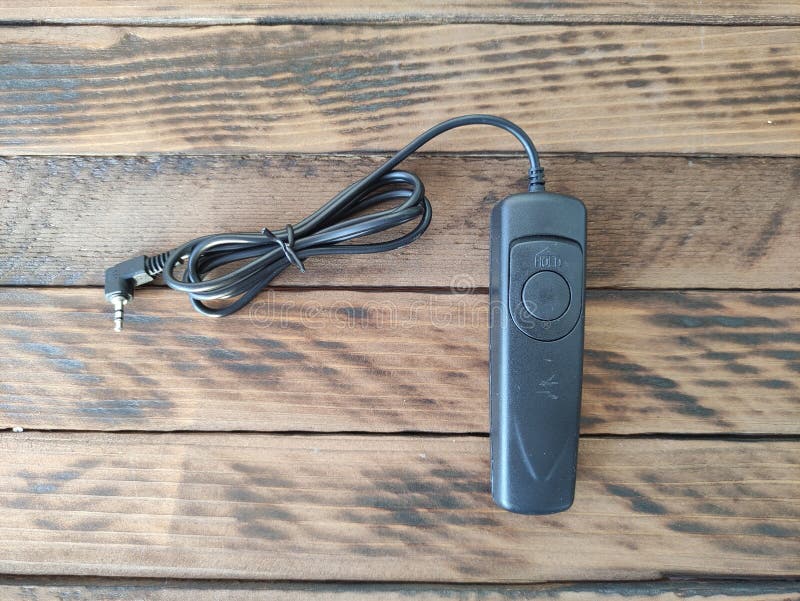 Wired Remote Control To Control the Camera on the Wooden Background ...