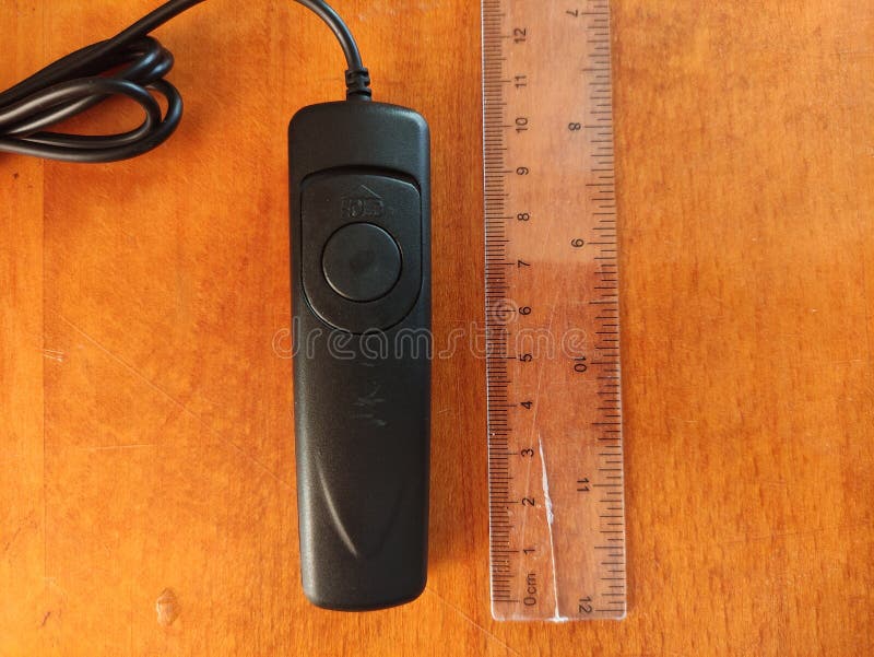Wired Remote Control To Control the Camera on the Wooden Background and ...