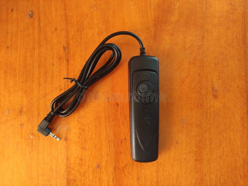 Wired Remote Control To Control the Camera on the Wooden Table Stock ...
