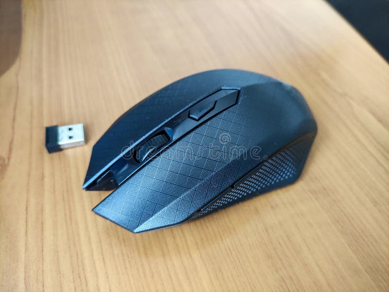 Wireless Black Gaming Mouse with Receiver on the Table Stock Image ...