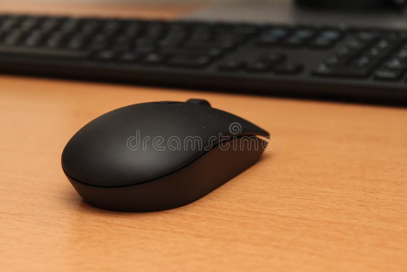 Wireless Black Stylish Computer Mouse Lying on Table. Stock Photo ...