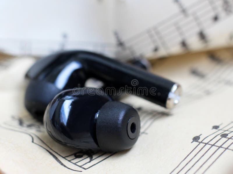 Wireless Bluetooth Earphone and Musical Notes Stock Photo - Image of ...