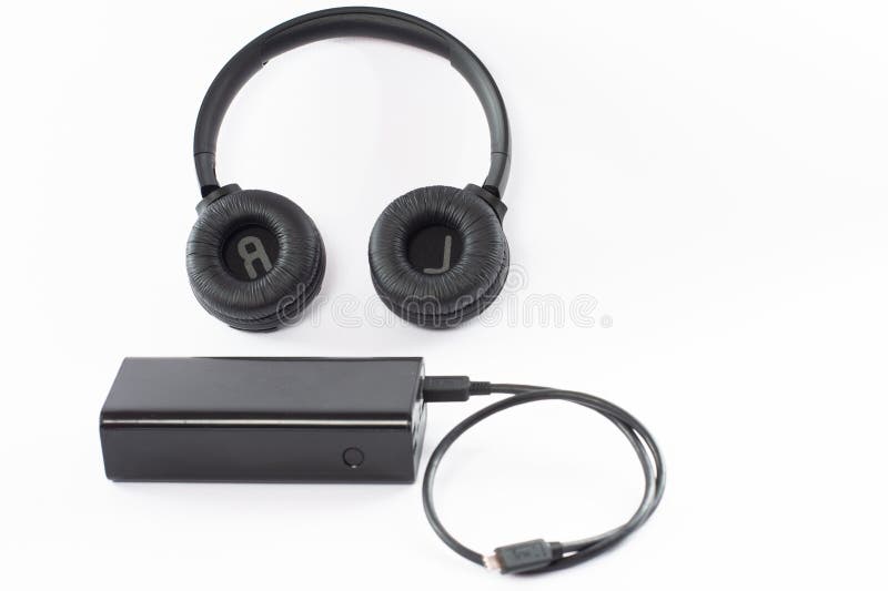 Wireless Bluetooth Headphones on a White Background with a Power Bank ...