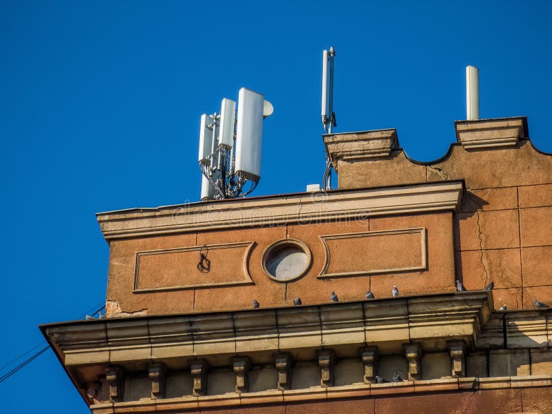Wireless Communication Antenna on Roof of Modern Building. Stock Image ...