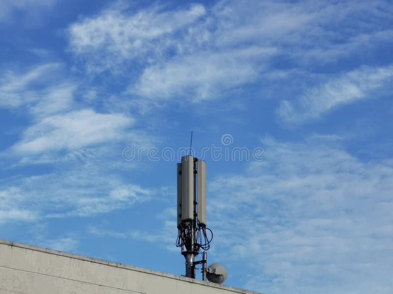 Wireless Communication Transmitter on the Rooftop. Selective Focus ...