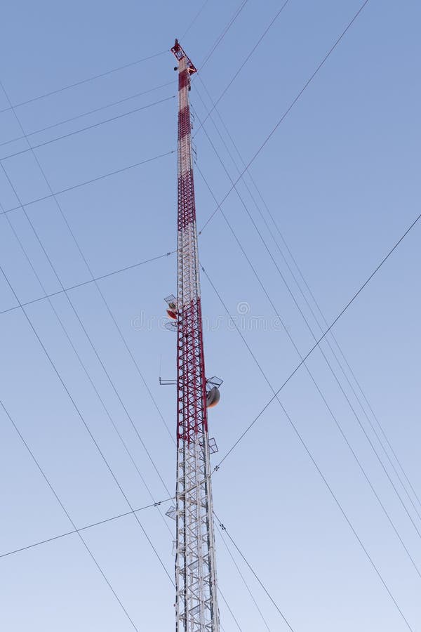 Wireless Communications Tower Against Blue Sky Stock Image - Image of ...