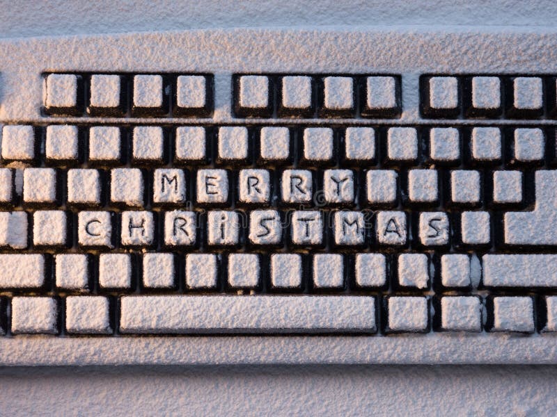 PC Keyboard Covered with Snow Illuminated by Blue Neon Light with ...