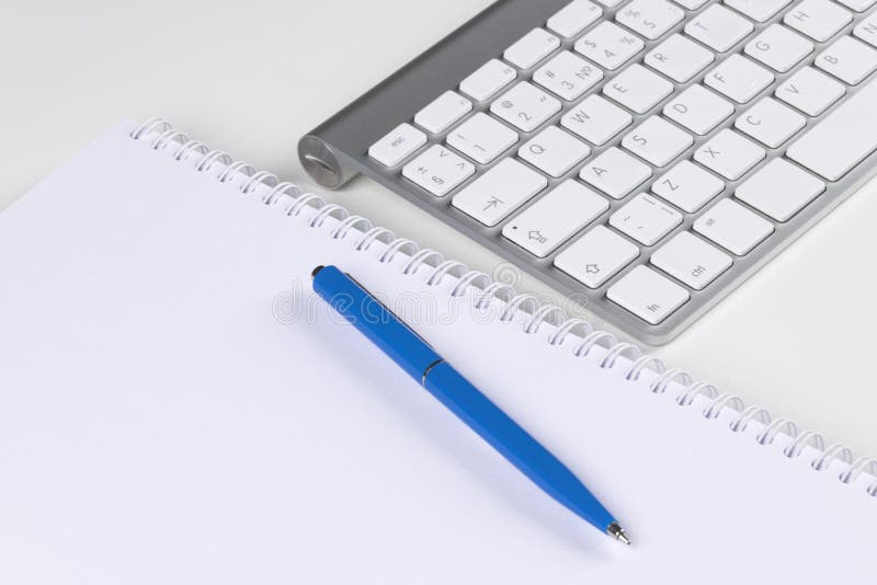 Wireless Computer Keyboard, Notebook and Pen on Business Office Table ...