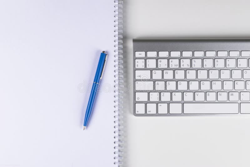 Wireless Computer Keyboard, Notebook and Pen on Business Office Table ...