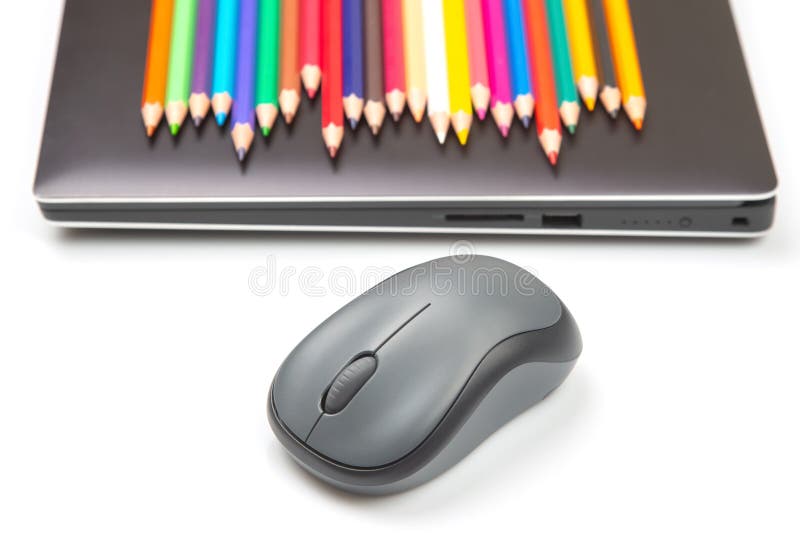 Wireless Computer Mouse on the Background of a Laptop with Colored ...
