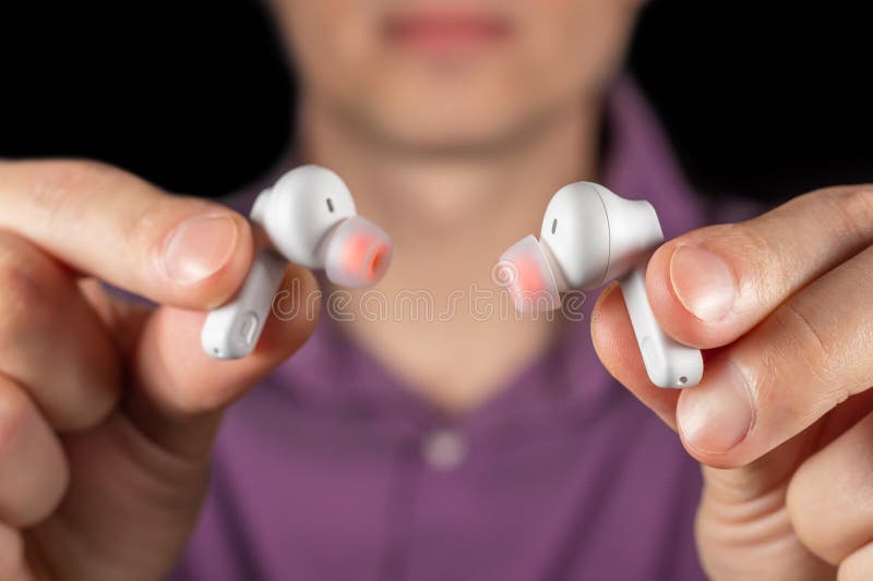 Wireless in-ear White Headphones in Hands Stock Photo - Image of ...