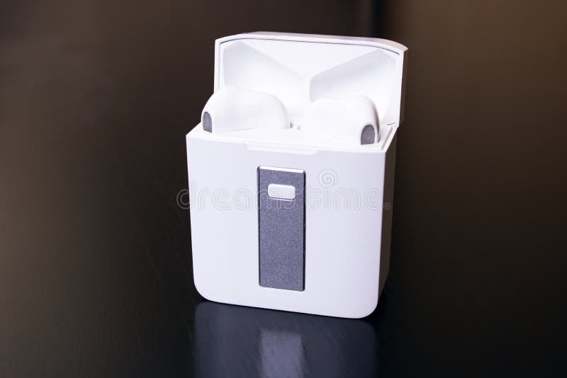Wireless Earbuds on a Wooden Table Closeup Stock Photo - Image of ...