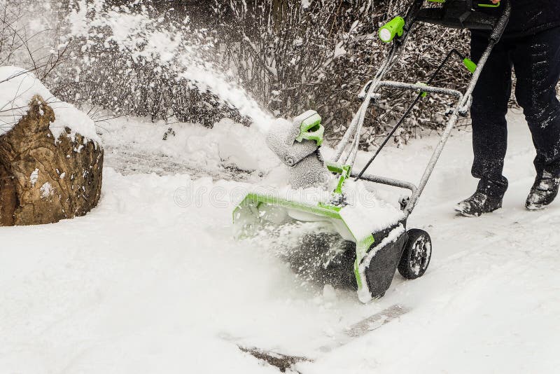 Wireless Electric Snow Blower at Work Stock Photo - Image of path ...
