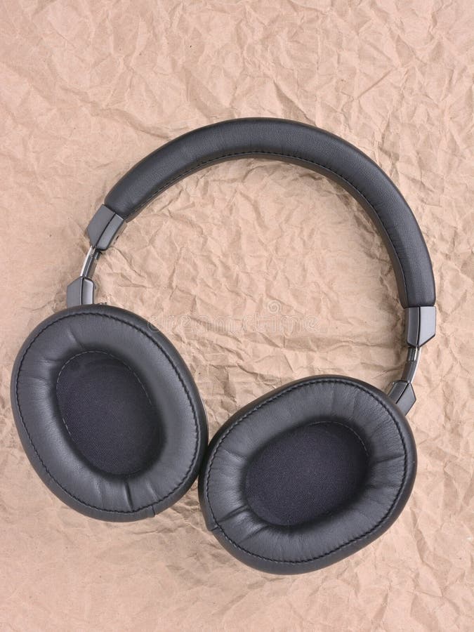 Wireless Headsets Close-up on a Background of Craft Paper Stock Photo ...