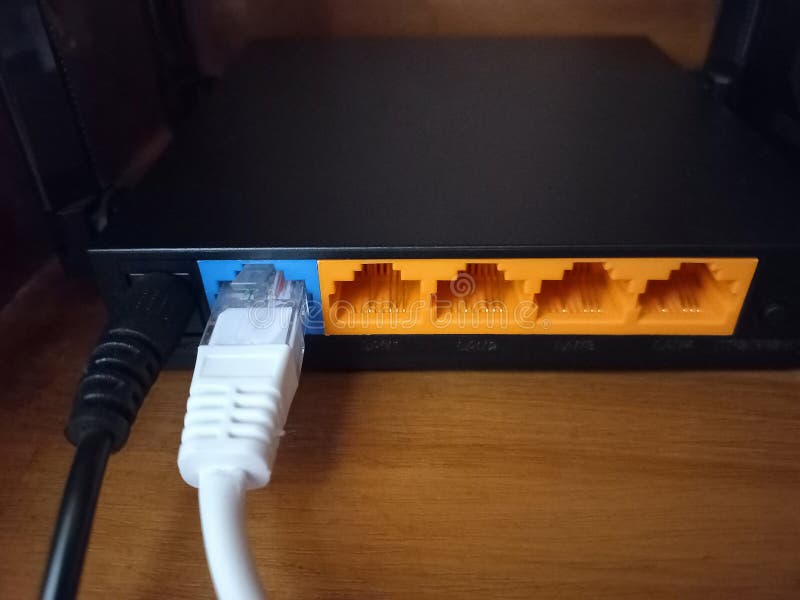 Wireless Internet Router Connected with Internet and Power Cable Stock ...