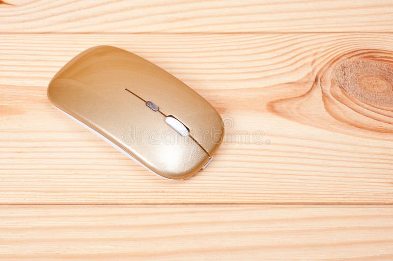 Wireless Mouse of Golden Color for a Computer or Laptop Stock Photo ...