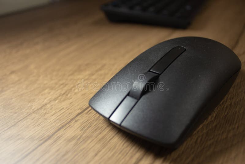 Wireless Mouse and Keyboard Set on Top of a Wooden Office Desk, on a ...