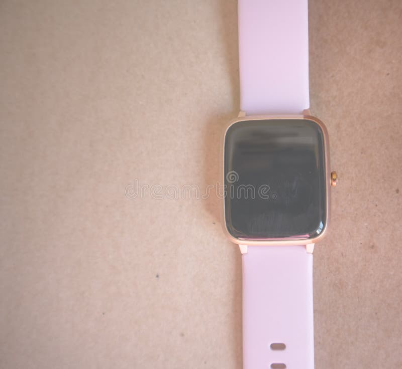 Wireless Smart Watch with Pink Strap Isolated on Brown Kraft Paper ...