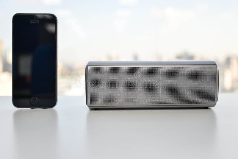 Wireless Speaker and Mobile Phone Stock Photo - Image of digital ...