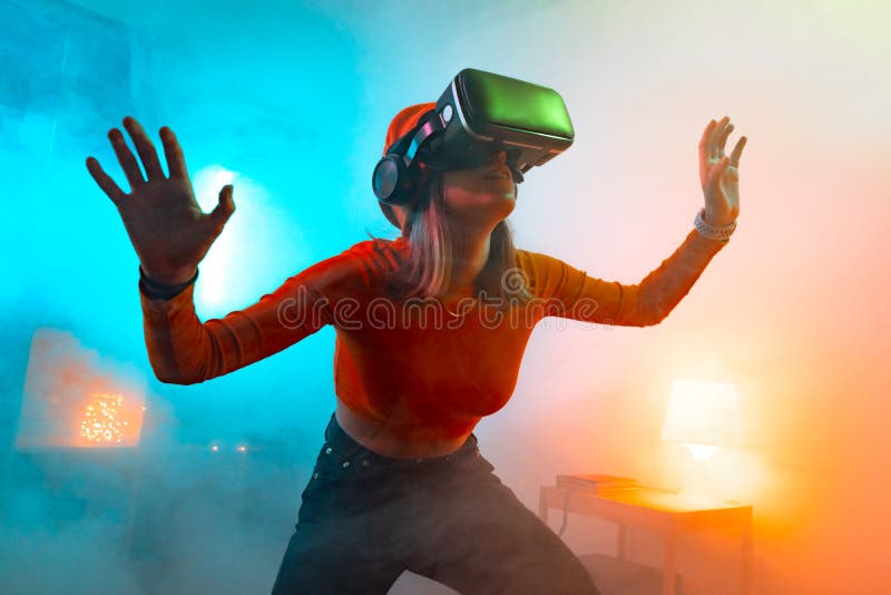 Wireless Technologies. Young Woman Using Virtual Reality Glasses in the ...