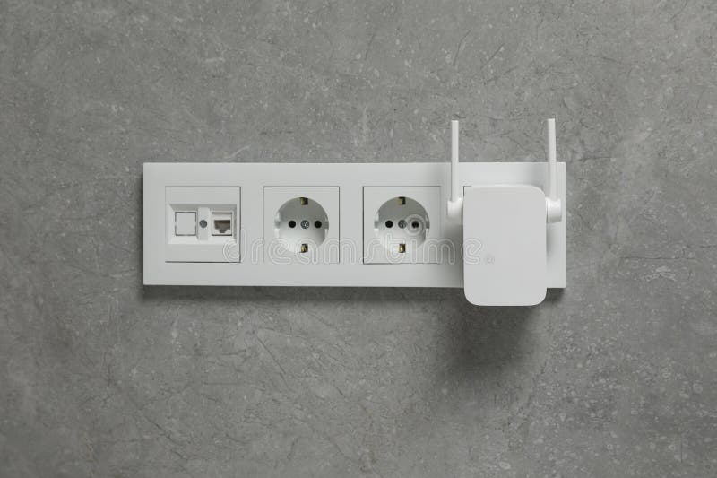 Wireless Wi-Fi Repeater on Light Grey Wall Stock Photo - Image of ...