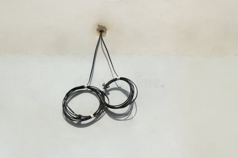 The Wires are in the Wall. Electrical Wires Stick Out of the Wall Stock ...