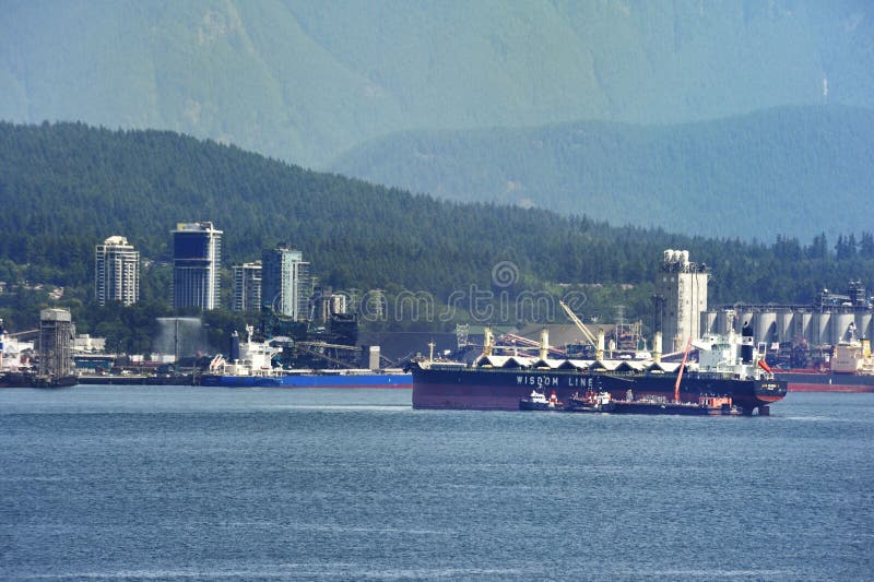 Wisdom Line Cargo Ship Being Moved with Tugs in the Harbour Editorial ...
