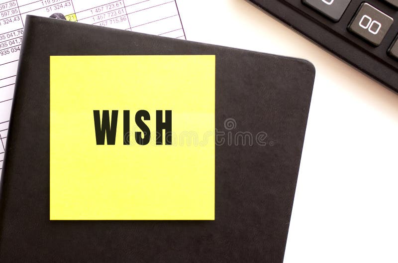 WISH Text on a Sticker on Your Desktop. Diary and Calculator Stock ...