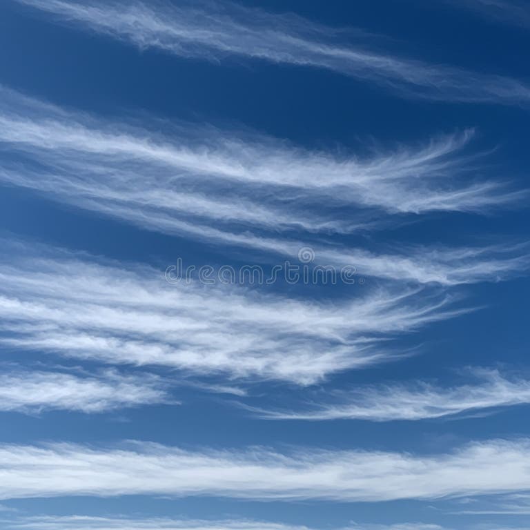 Wispy Cirrus Clouds Stretch Across a Clear Blue Sky, Creating a ...