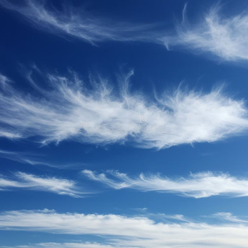 Wispy Cirrus Clouds Stretch Across a Deep Blue Sky. the Clouds are Thin ...