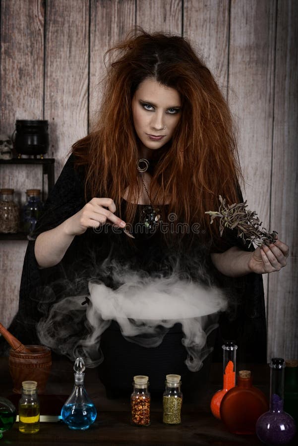 Witch Stirring Her Magic Potion with Her Wand Stock Image - Image of ...