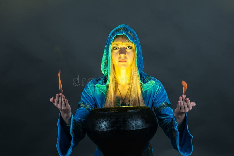 Witch with fire in hands stock image. Image of blond - 36694147