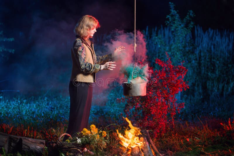 Witch by Fire in Night Forest Prepares Magic Potion Stock Image - Image ...