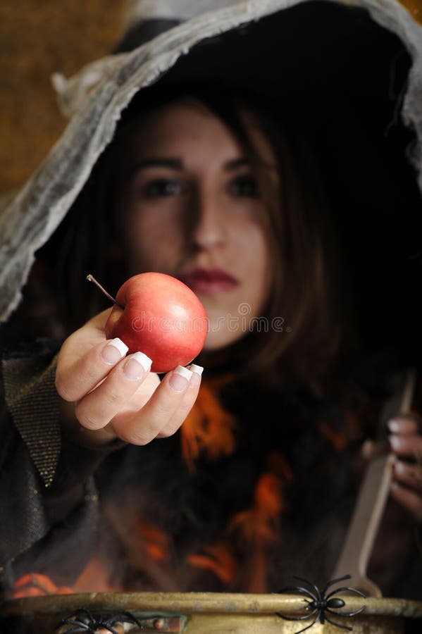 Witch Giving a Poisened Apple Stock Photo - Image of apple, halloween ...