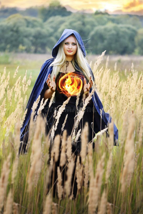 Witch holding a fireball stock image. Image of female - 75898167