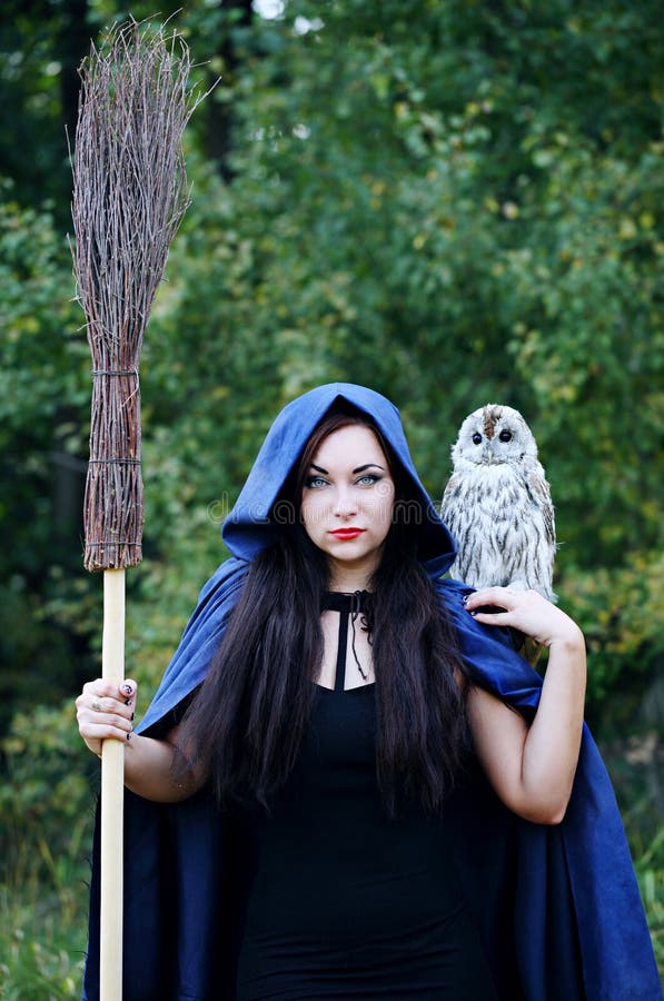 Witch in the Hood with an Owl in the Forest Stock Photo - Image of ...