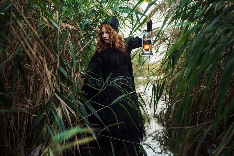 Witch with Light on a Swamp Stock Photo - Image of magic, lake: 81017610