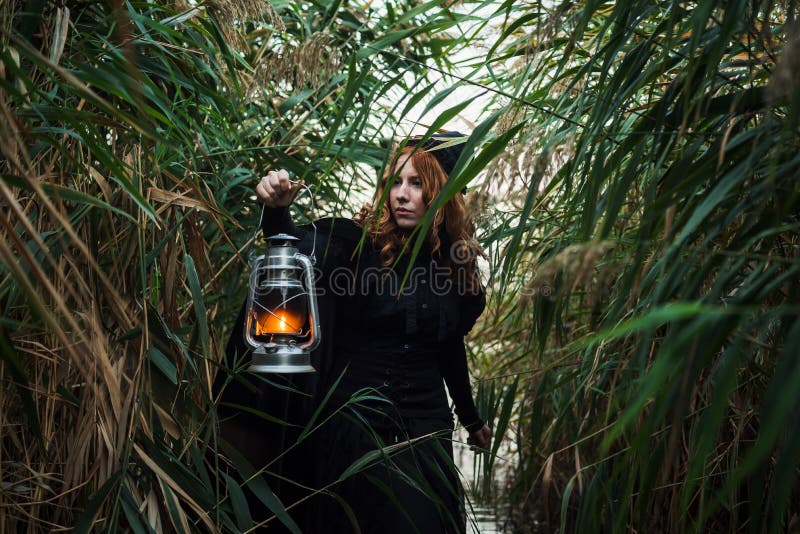 Witch with Light on a Swamp Stock Image - Image of person, practicing ...
