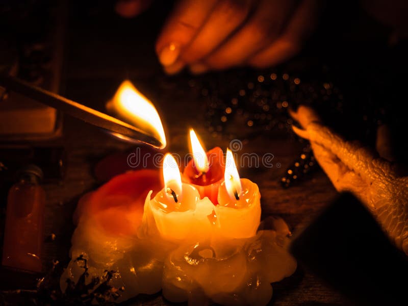 A Witch Lights a Wand from a Candle for Magical Rituals. Attributes of ...