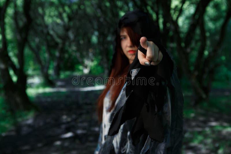 Witch Pointing Finger at Camera Stock Image - Image of defocused, dark ...