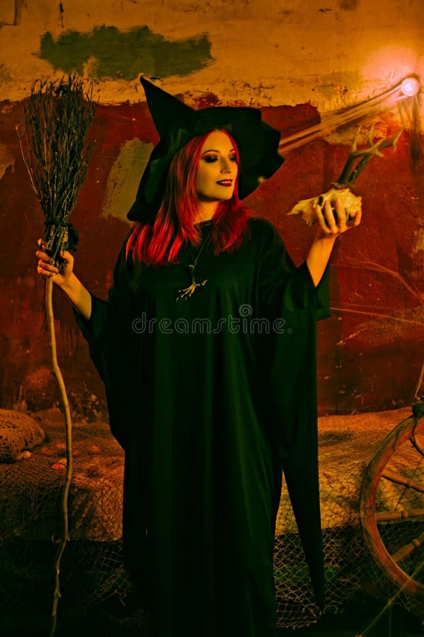 Witch in a Red-haired Hat. Halloween Concept. Stock Image - Image of ...