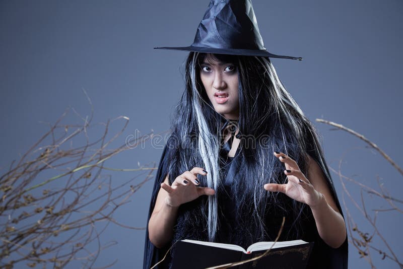 Witch using spell book stock image. Image of angry, wizard - 60197309