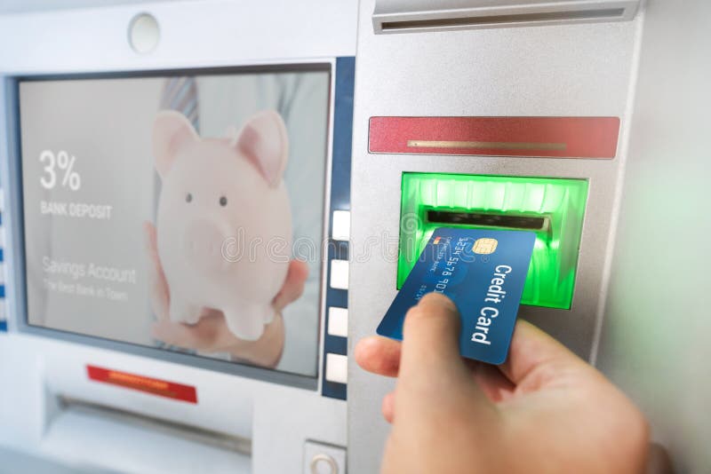 Withdraw Money from an ATM Using a Credit Card Stock Photo - Image of ...