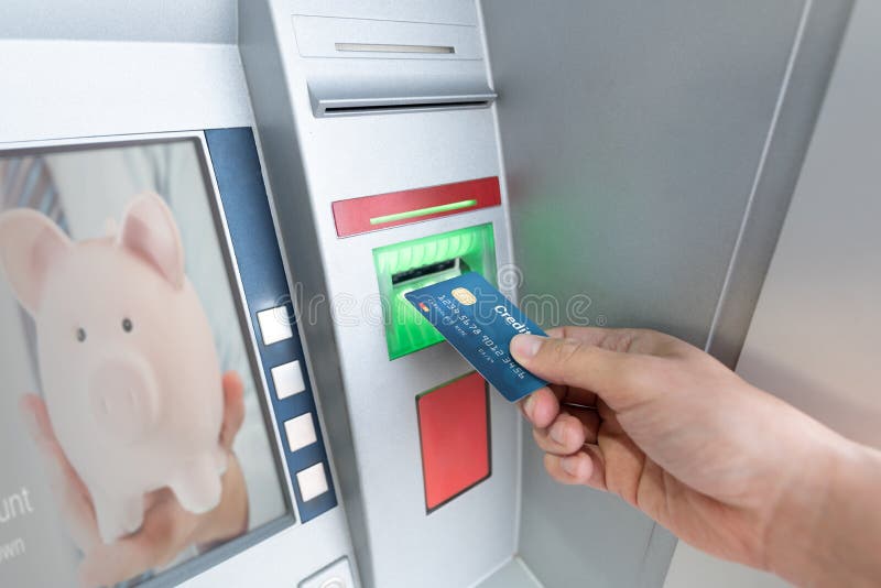 Withdraw Money from an ATM Using a Credit Card Stock Photo - Image of ...