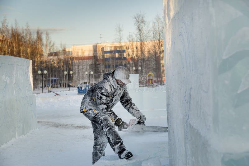 The Wizard Cuts Figures from the Ice Chainsaw Stock Photo - Image of ...