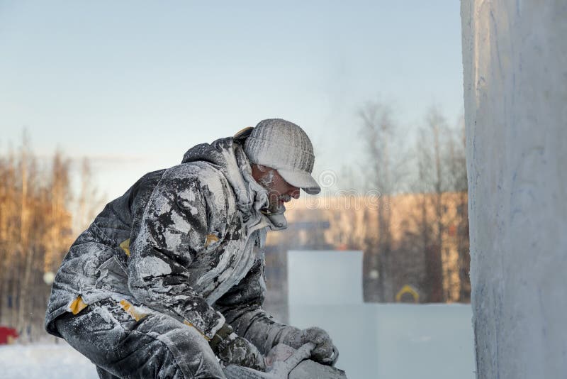 The Wizard Cuts Figures from the Ice Chainsaw Stock Photo - Image of ...