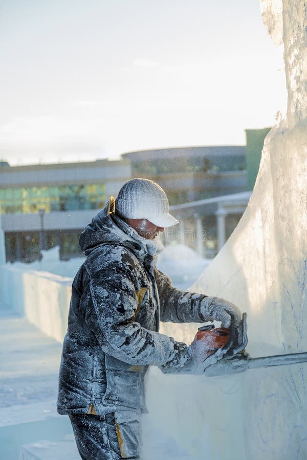 The Wizard Cuts Figures from the Ice Chainsaw Stock Photo - Image of ...