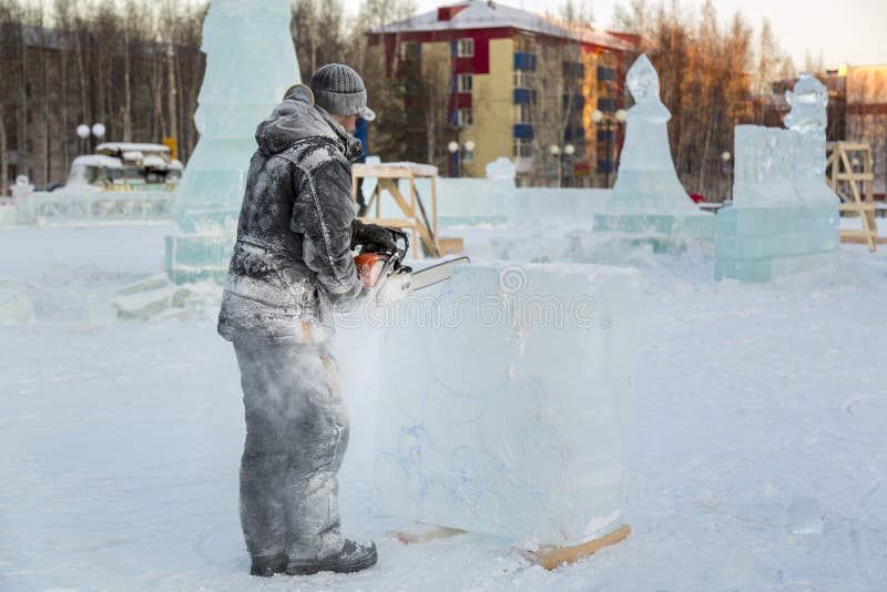 The Wizard Cuts Figures from the Ice Chainsaw Stock Photo - Image of ...