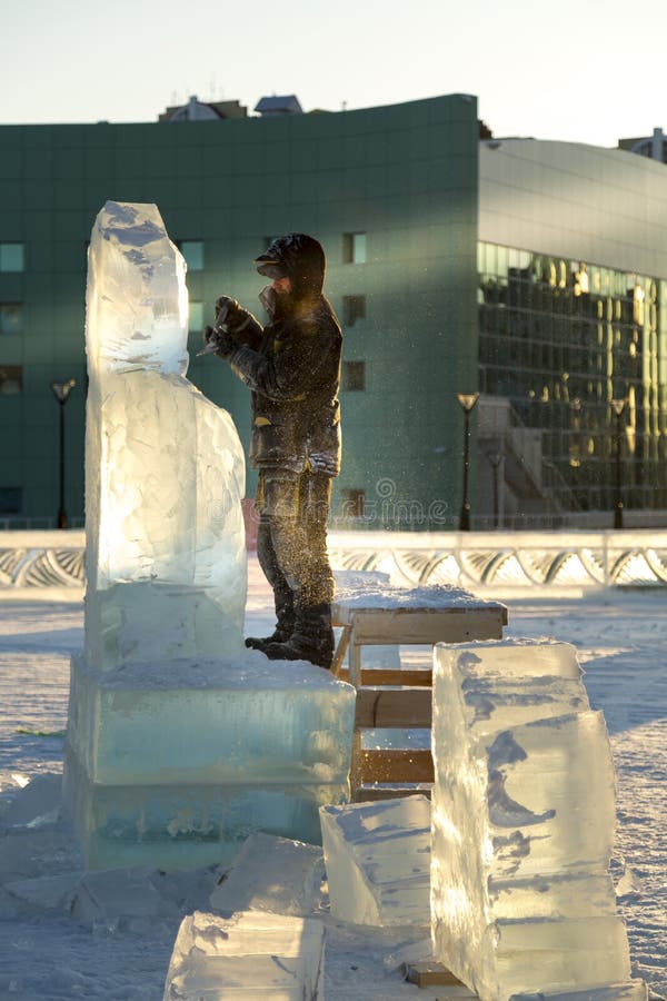 The Wizard Cuts Figures from the Ice Chainsaw Stock Image - Image of ...