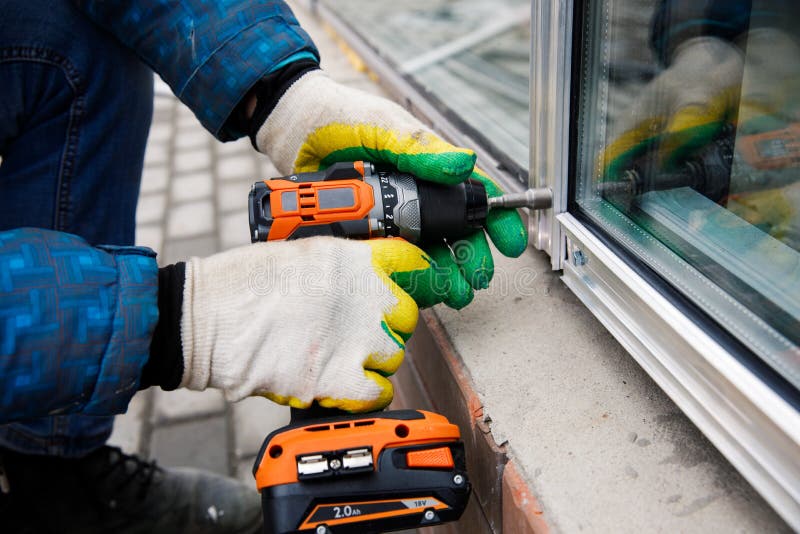 The Wizard is Engaged in Installing Windows. Repair Work. Stock Image ...